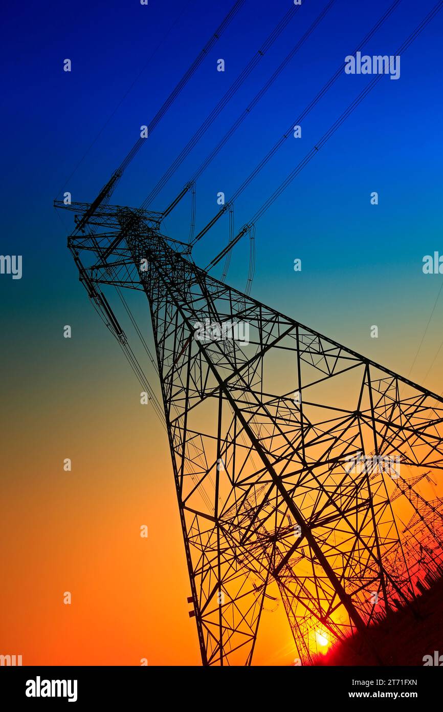 Pylon, high-voltage tower sky background Stock Photo - Alamy