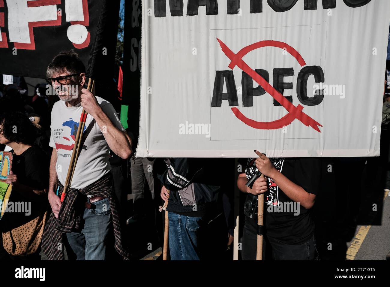 San Francisco, USA. 12th Nov, 2023. People hold the anti-APEC placards ...