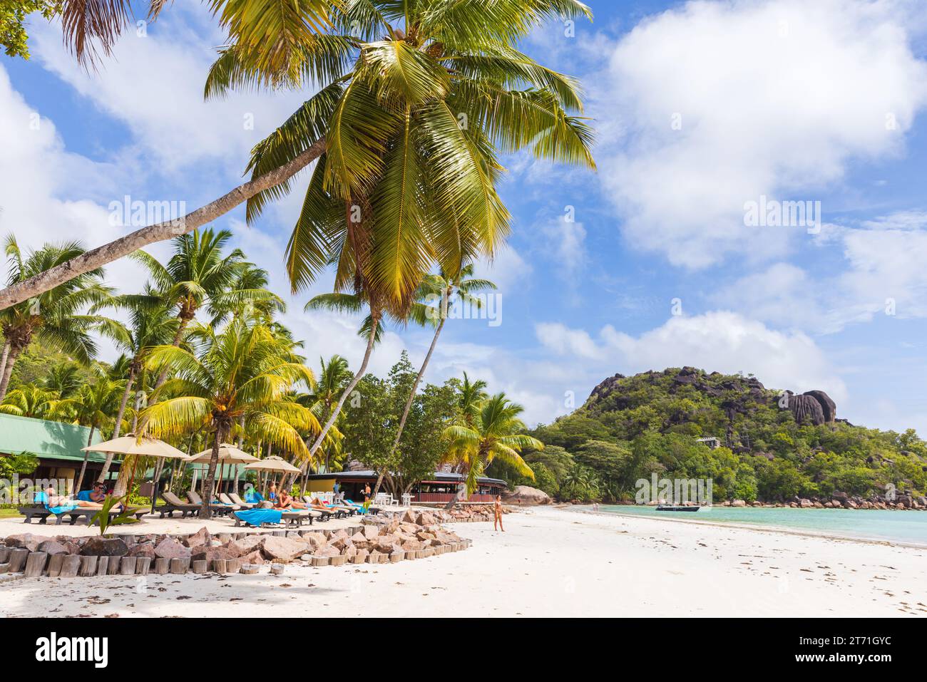 Praslin, Seychelles - August 15, 2023: Tourists rest at the beach with ...