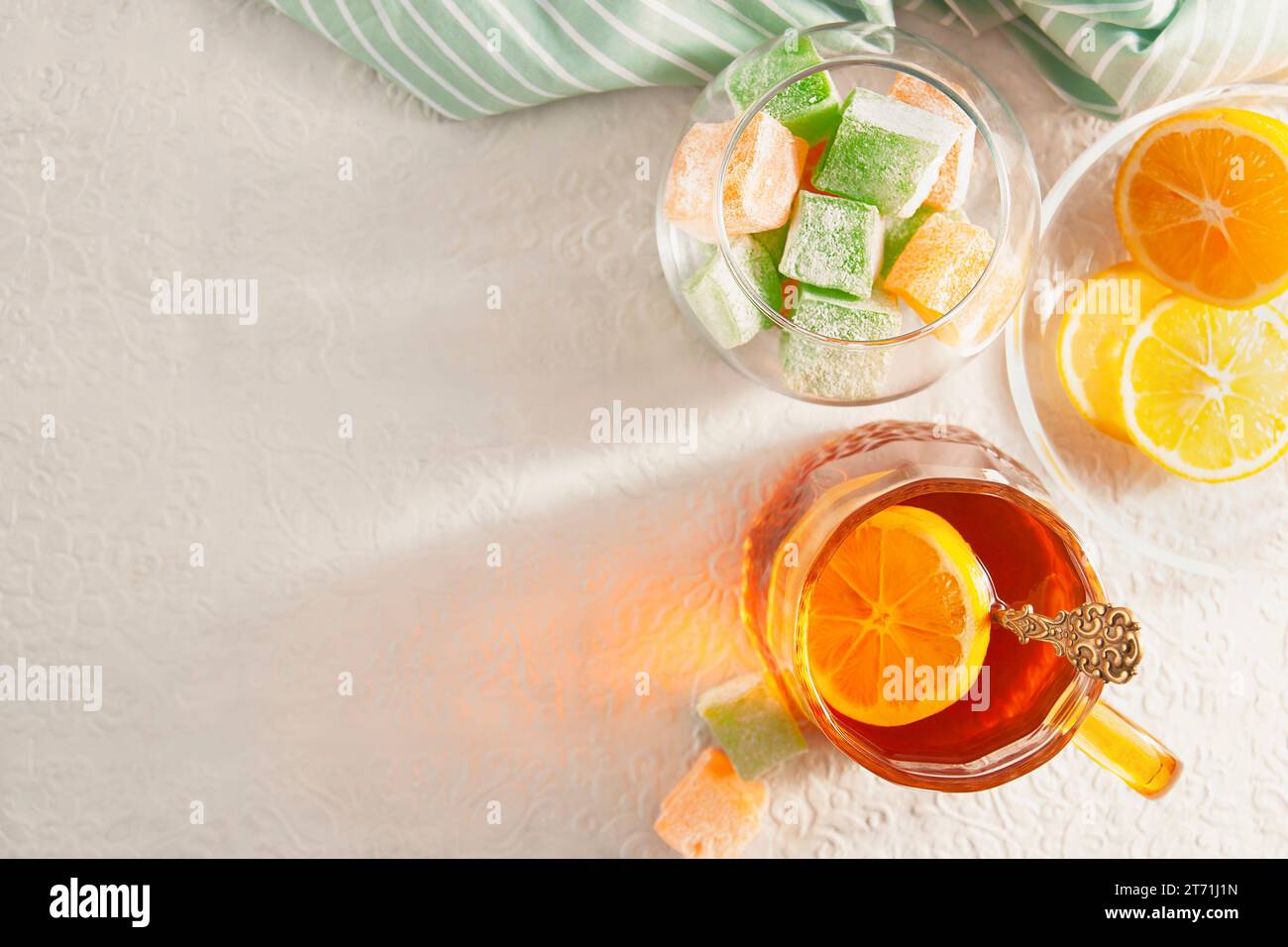 Oriental sweetness – Turkish delight and tea with lemon White table ...