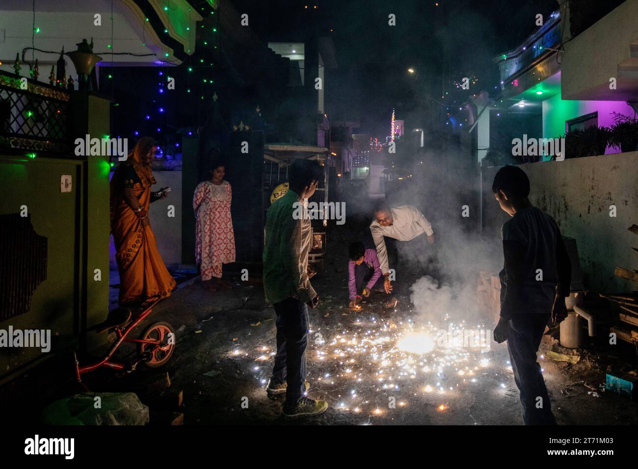 Prayagraj, India. 12th Nov, 2023. Indian people burn firecrackers on ...
