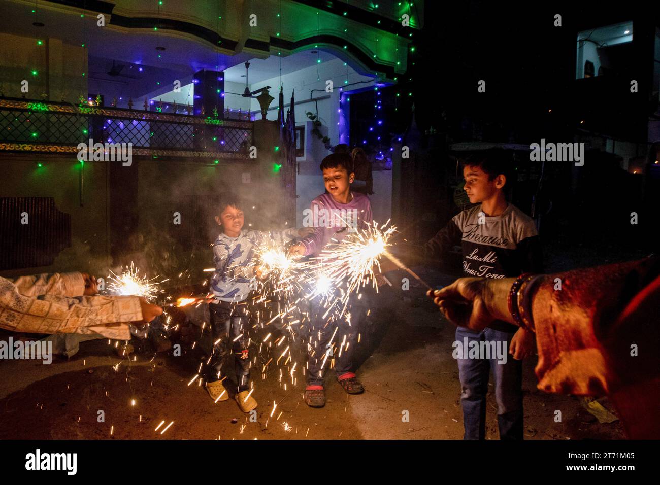Prayagraj, India. 12th Nov, 2023. Indian people burn firecrackers on ...