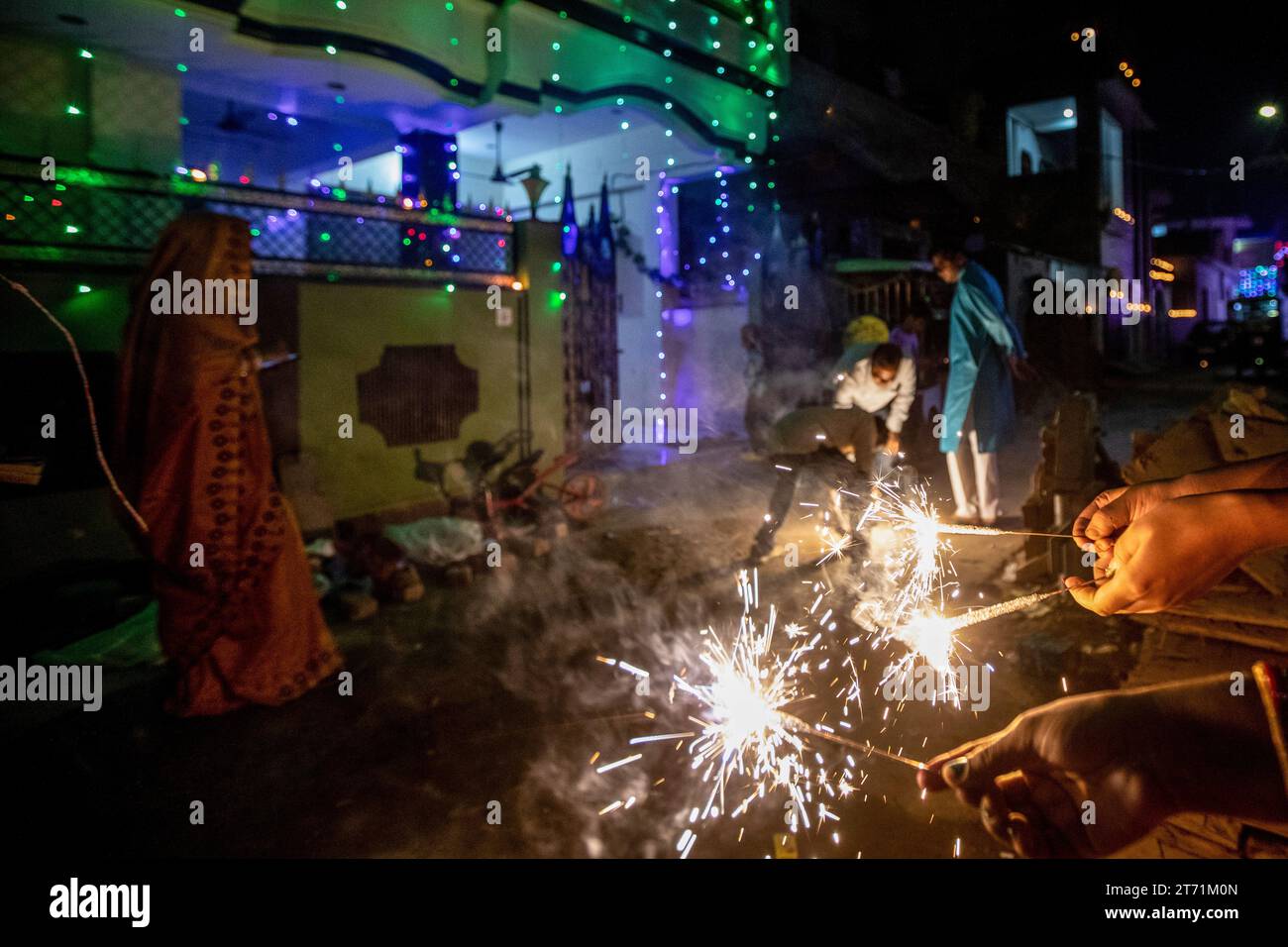 Prayagraj, India. 12th Nov, 2023. Indian people burn firecrackers on ...