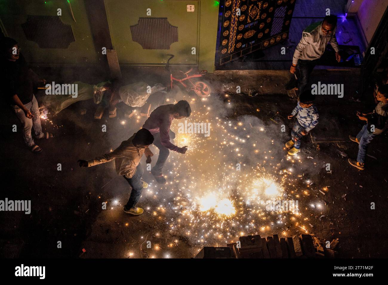 Prayagraj, India. 12th Nov, 2023. Indian people burn firecrackers on ...