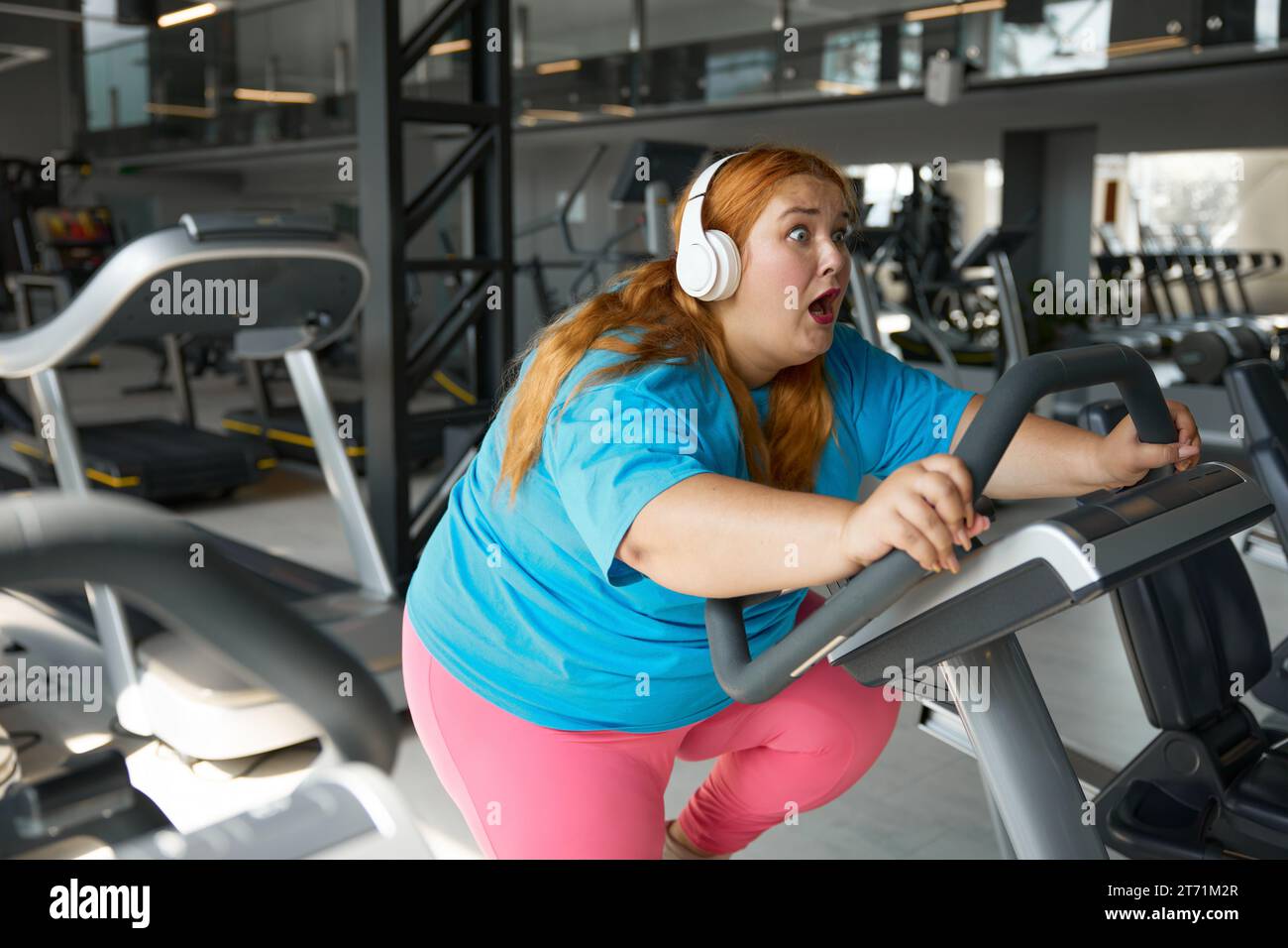 Overweight woman riding bike hi-res stock photography and images - Alamy