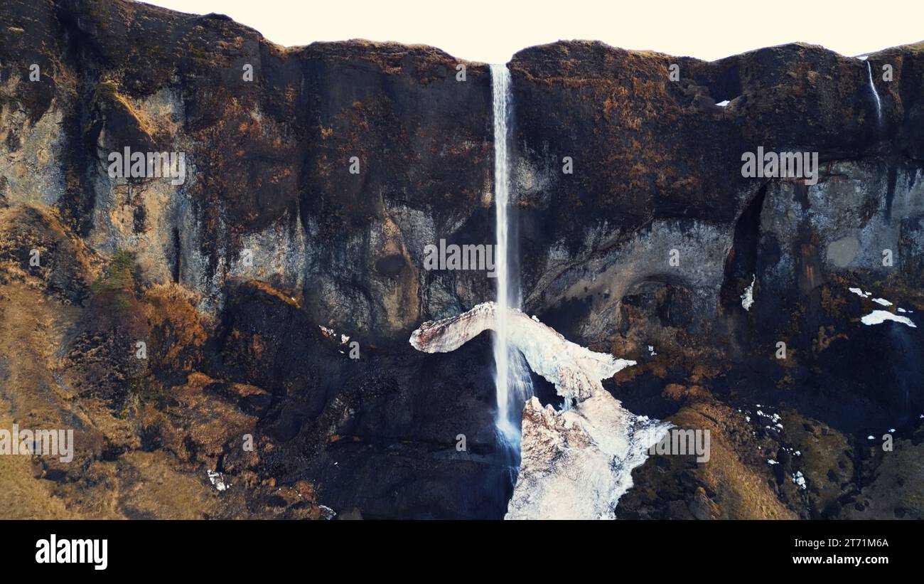 Aerial view of foss a sidu cascade in iceland running off of hills ...