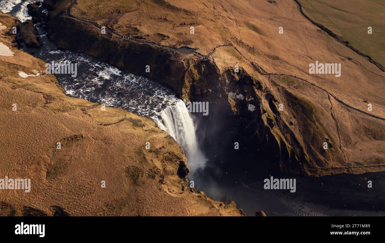 Drone shot of skgafoss waterfall forming beautiful rainbow, icelandic ...