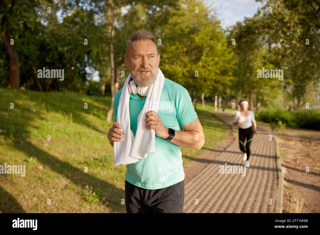 Elderly people jogging, sports activities for senior man and woman ...