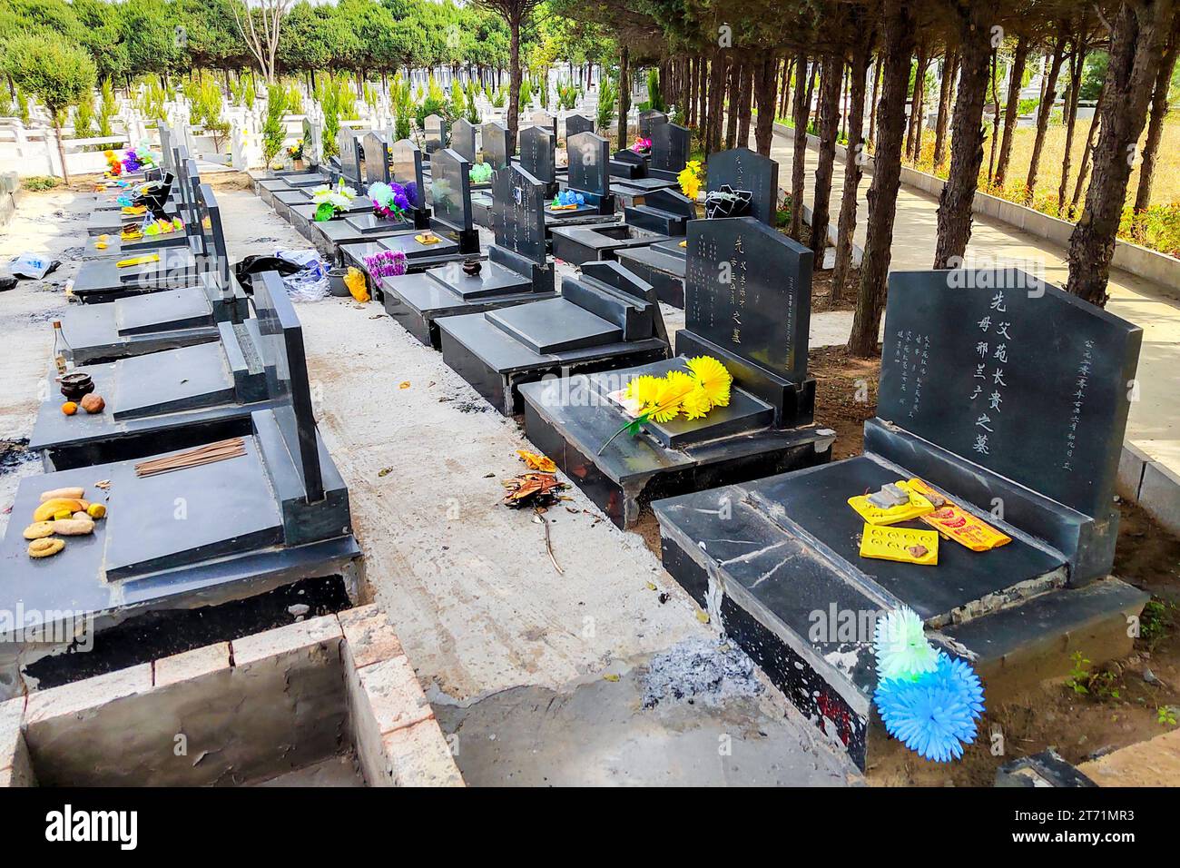 ANYANG, CHINA - NOVEMBER 13, 2023 - People place flowers and offerings ...