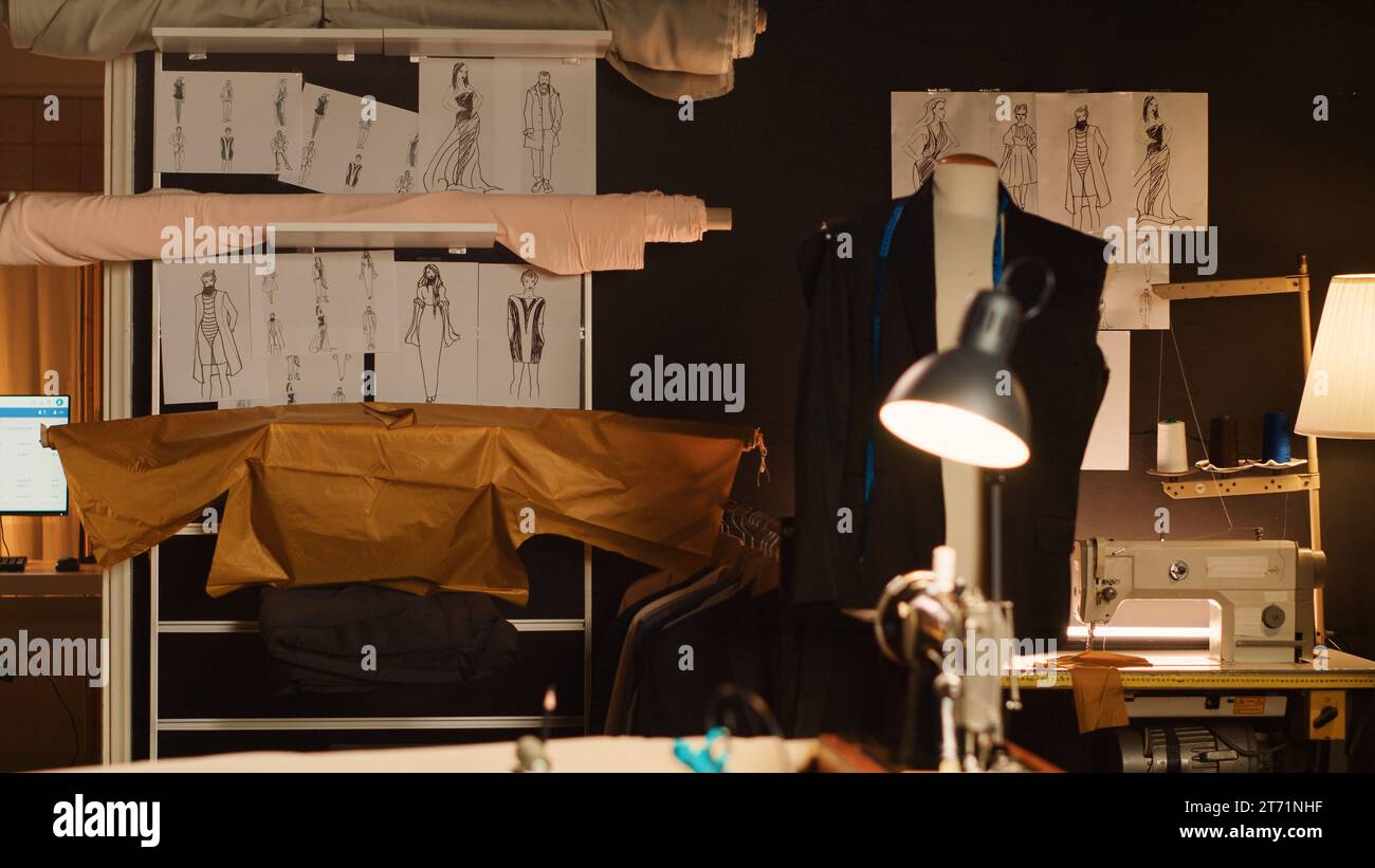 Luxury fashion atelier with sketches, sewing instruments and tools used ...