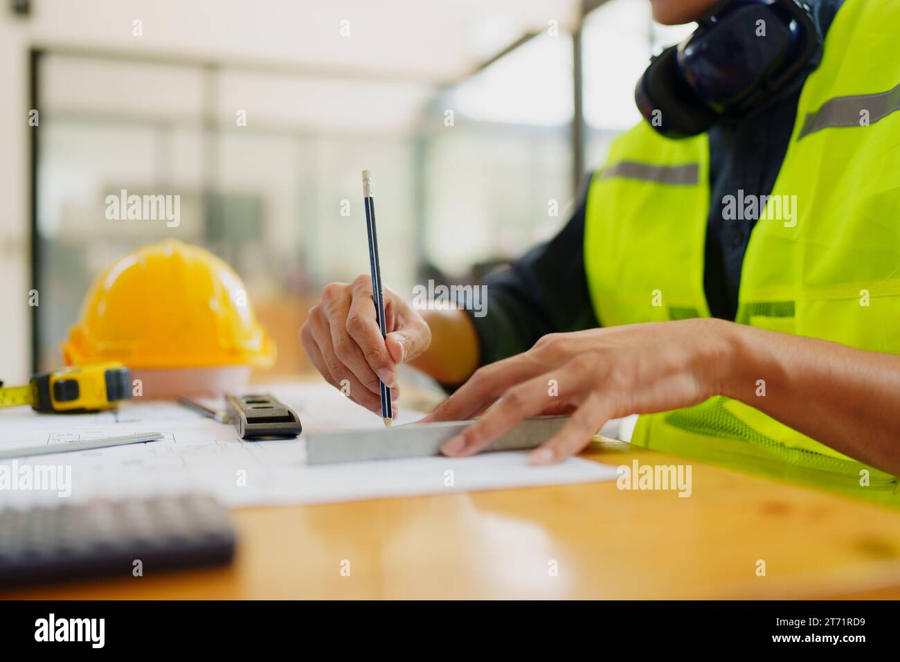 engineers discuss building on blueprint drawing, design building ...