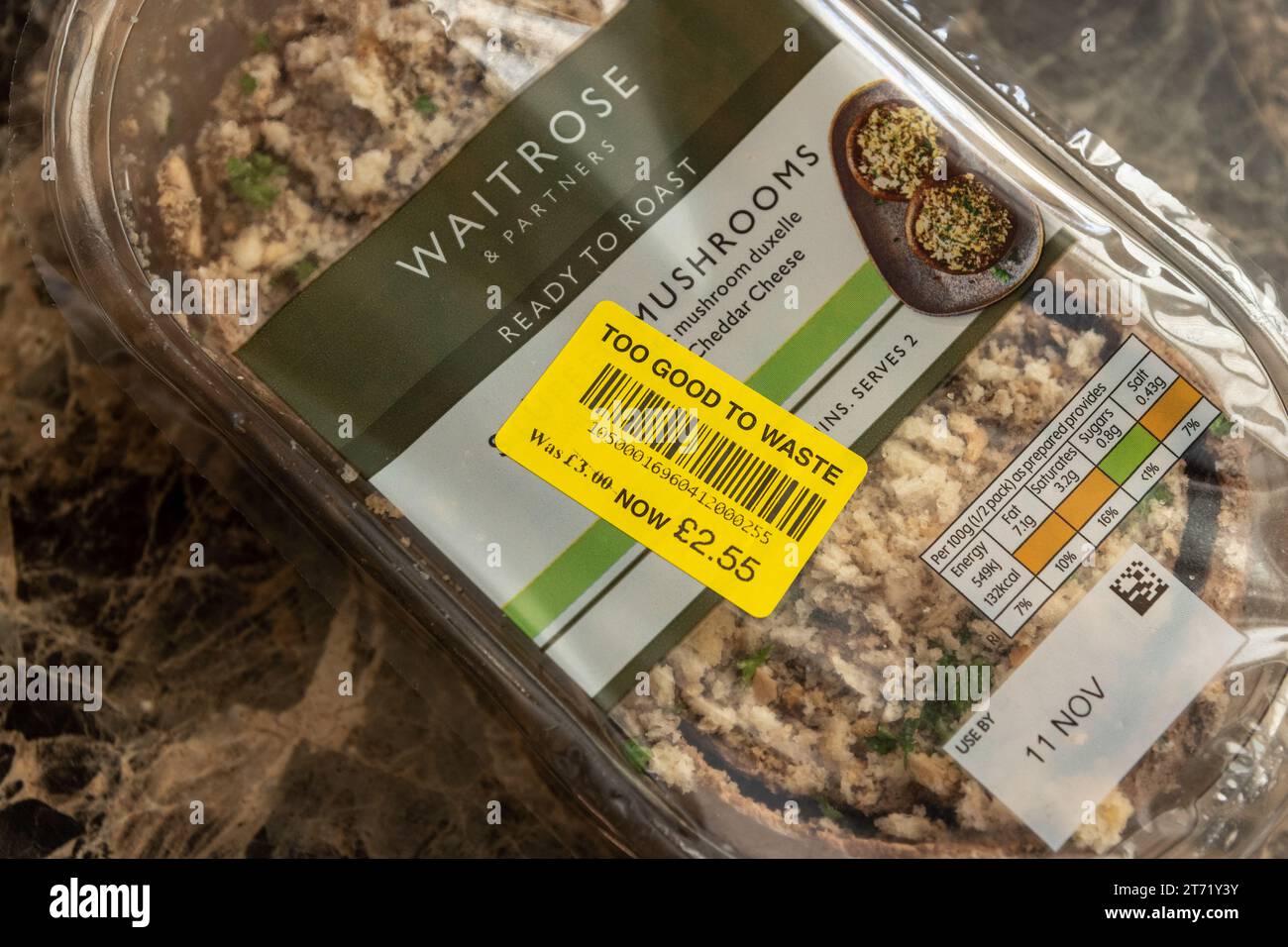 Yellow Too Good To Waste sticker on a box of Waitrose mushrooms Stock ...