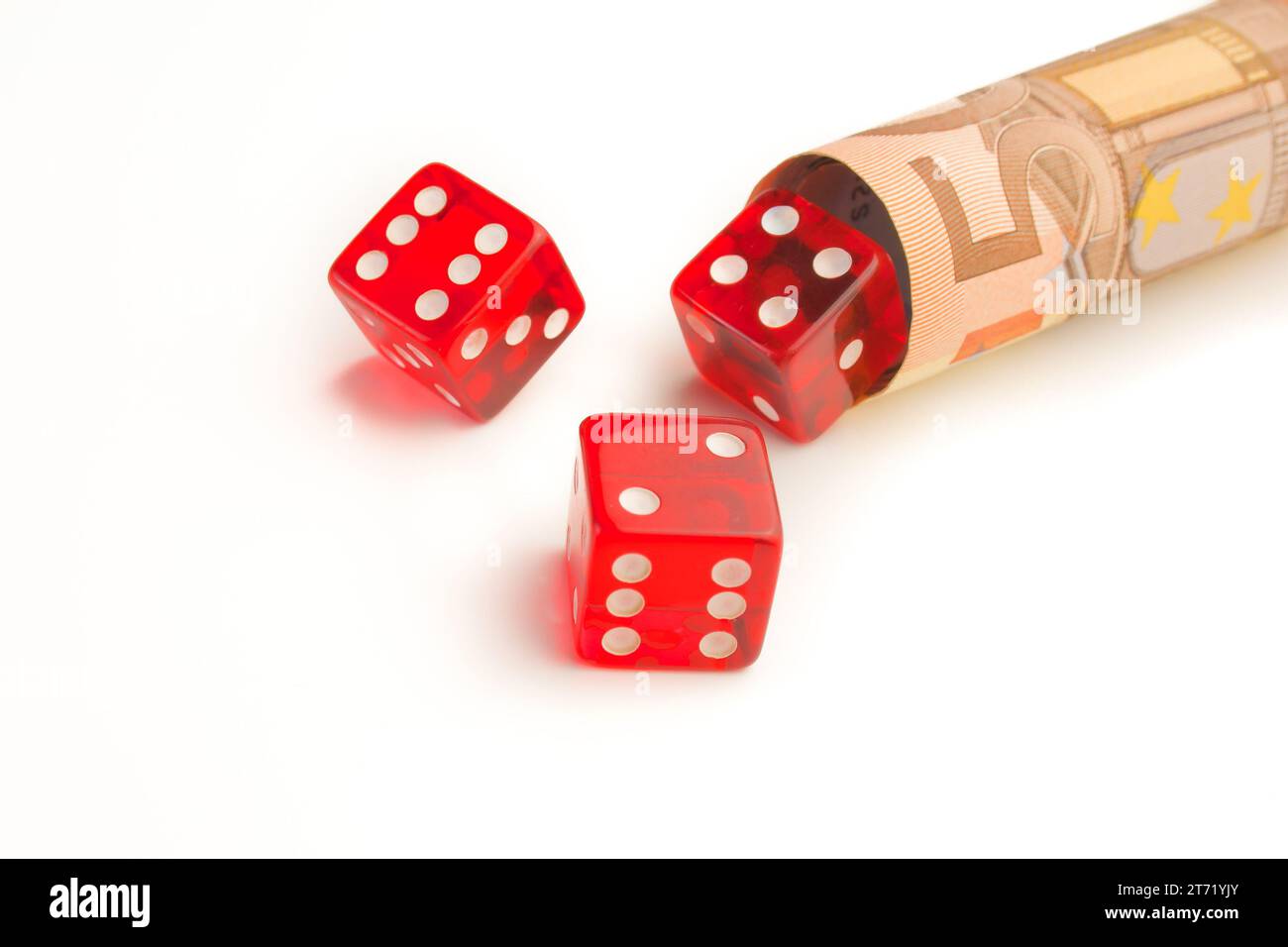 Close up Money rolled up with three dice ; Close up Money rolled up ...