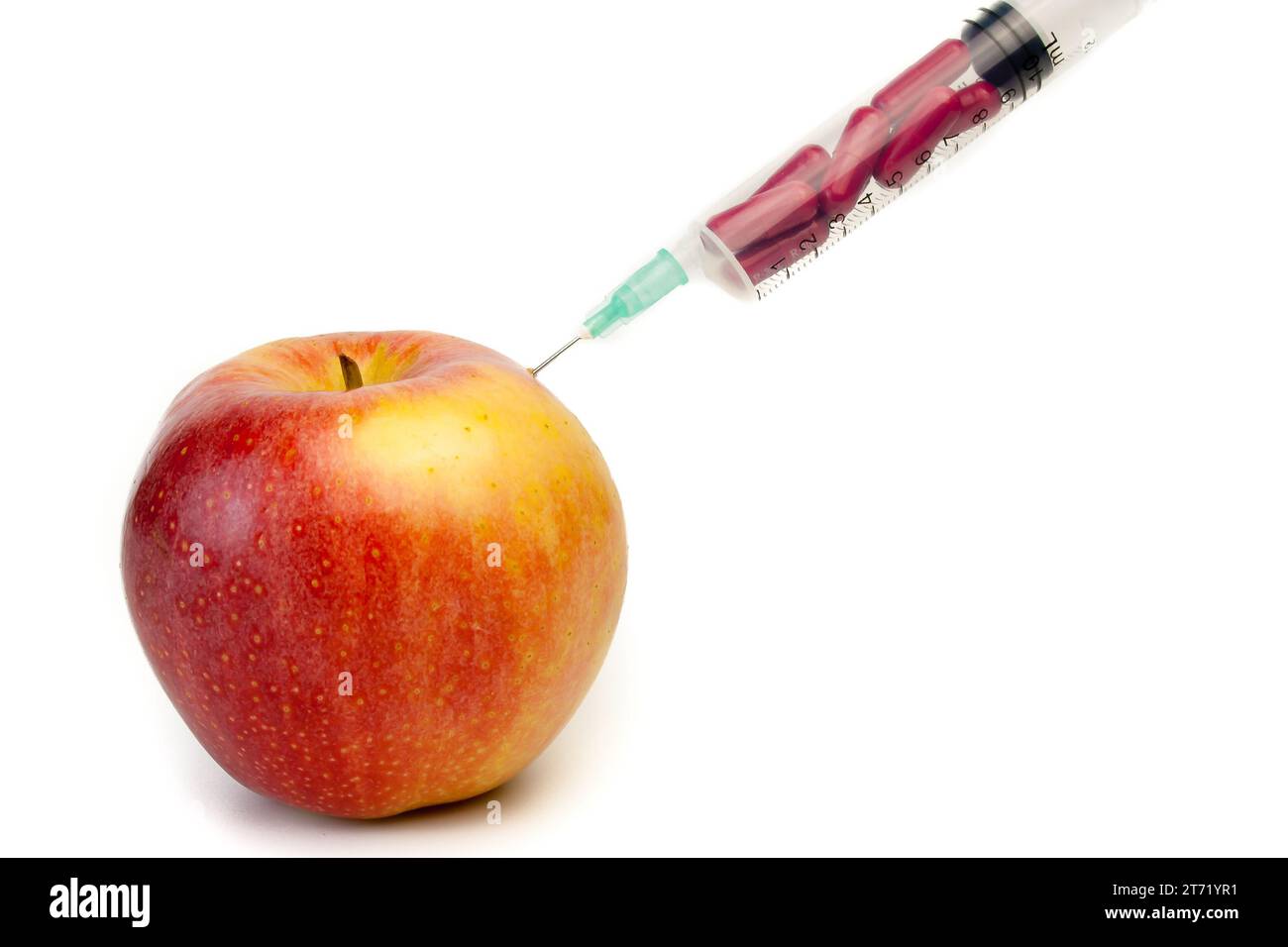 detail of a injection and a apple; detail of a injection and a apple ...