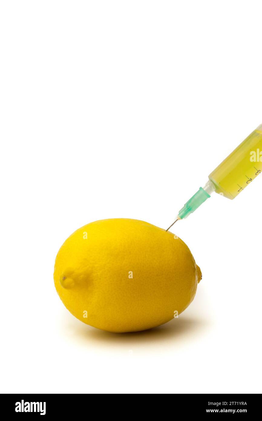 detail of a injection and a lemon; detail of a injection and a lemon ...