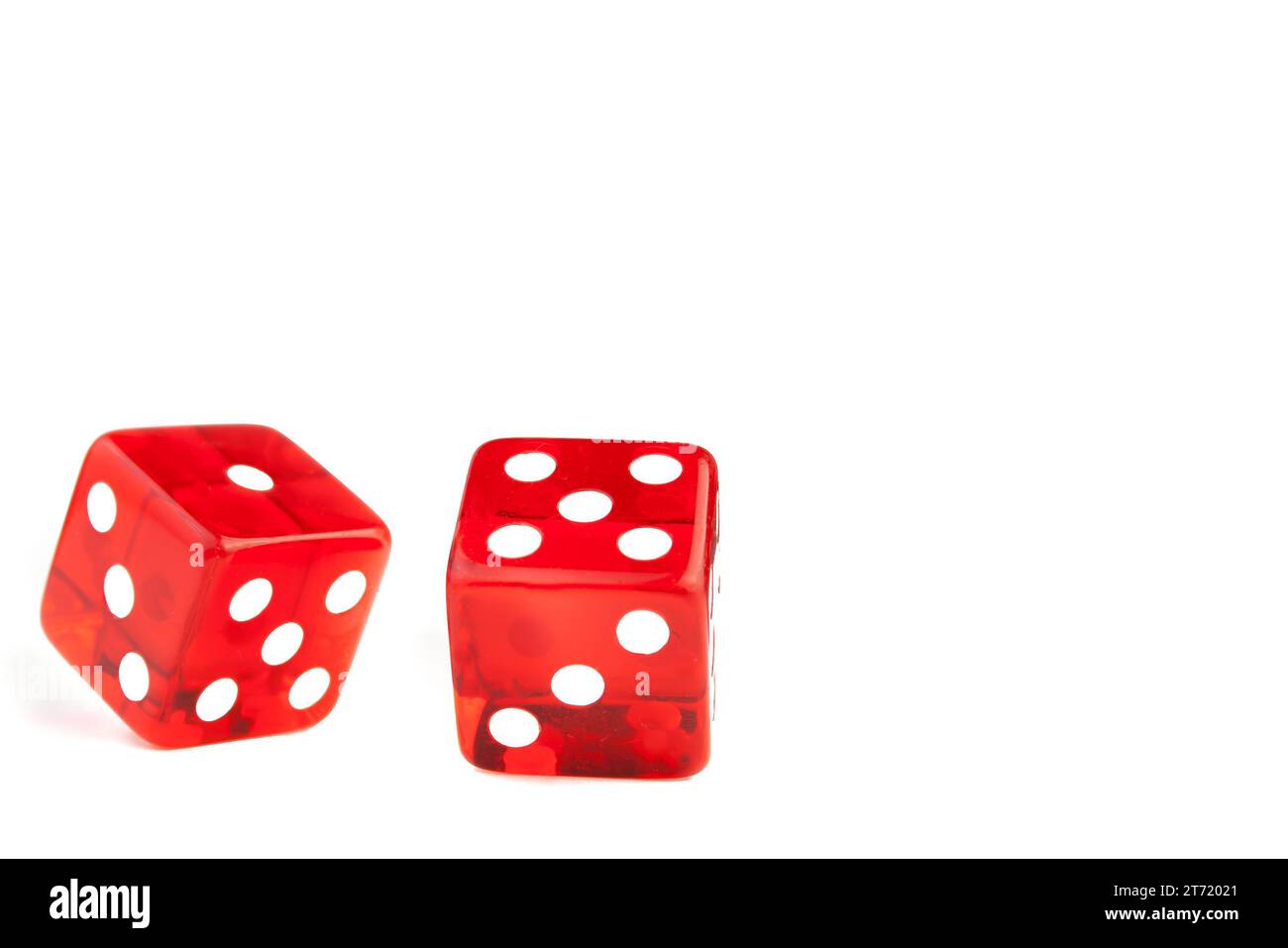 red dice on white background with space for text Stock Photo - Alamy