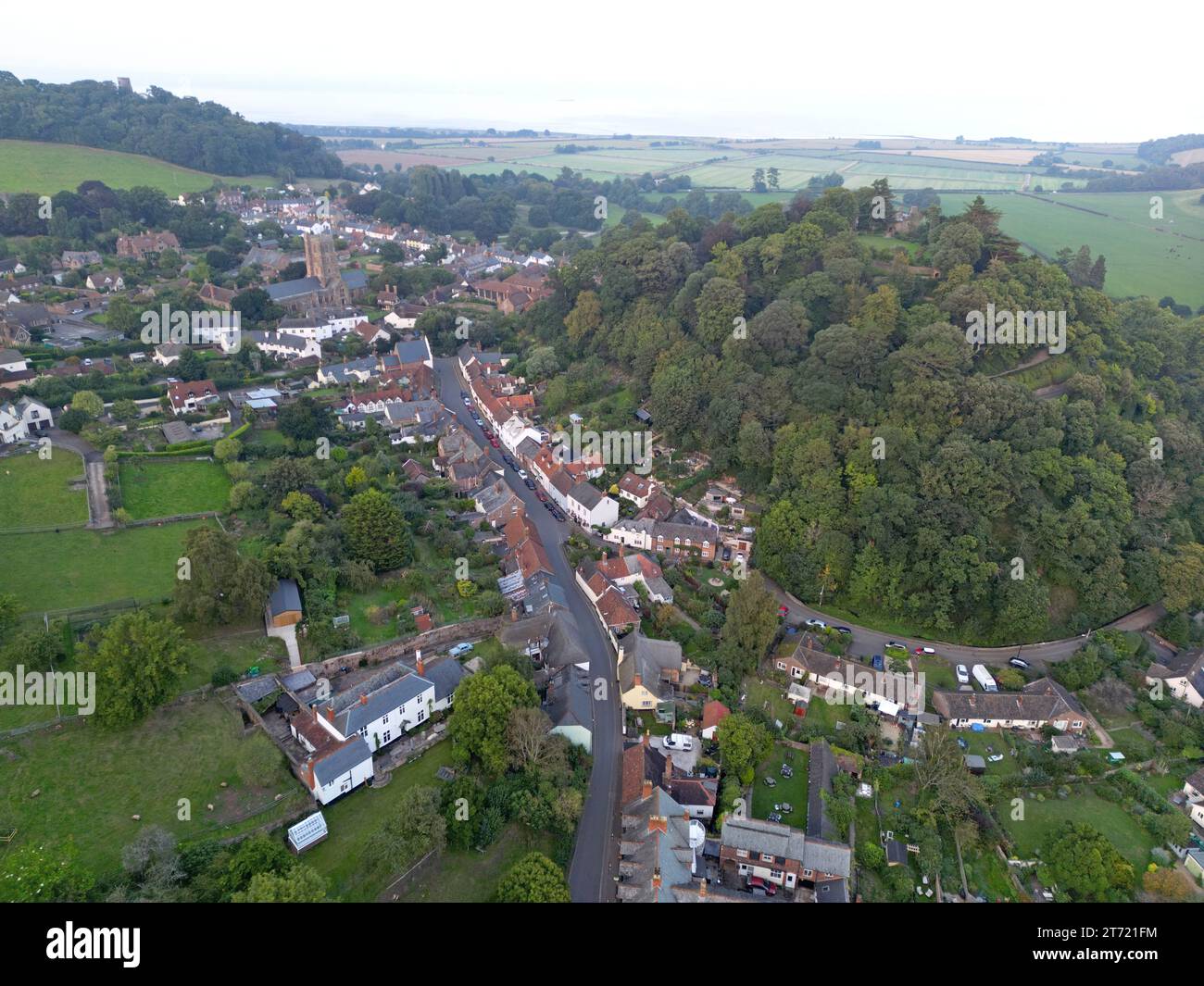 Aerial drone view of Dunster Castle and historic village of Dunster ...