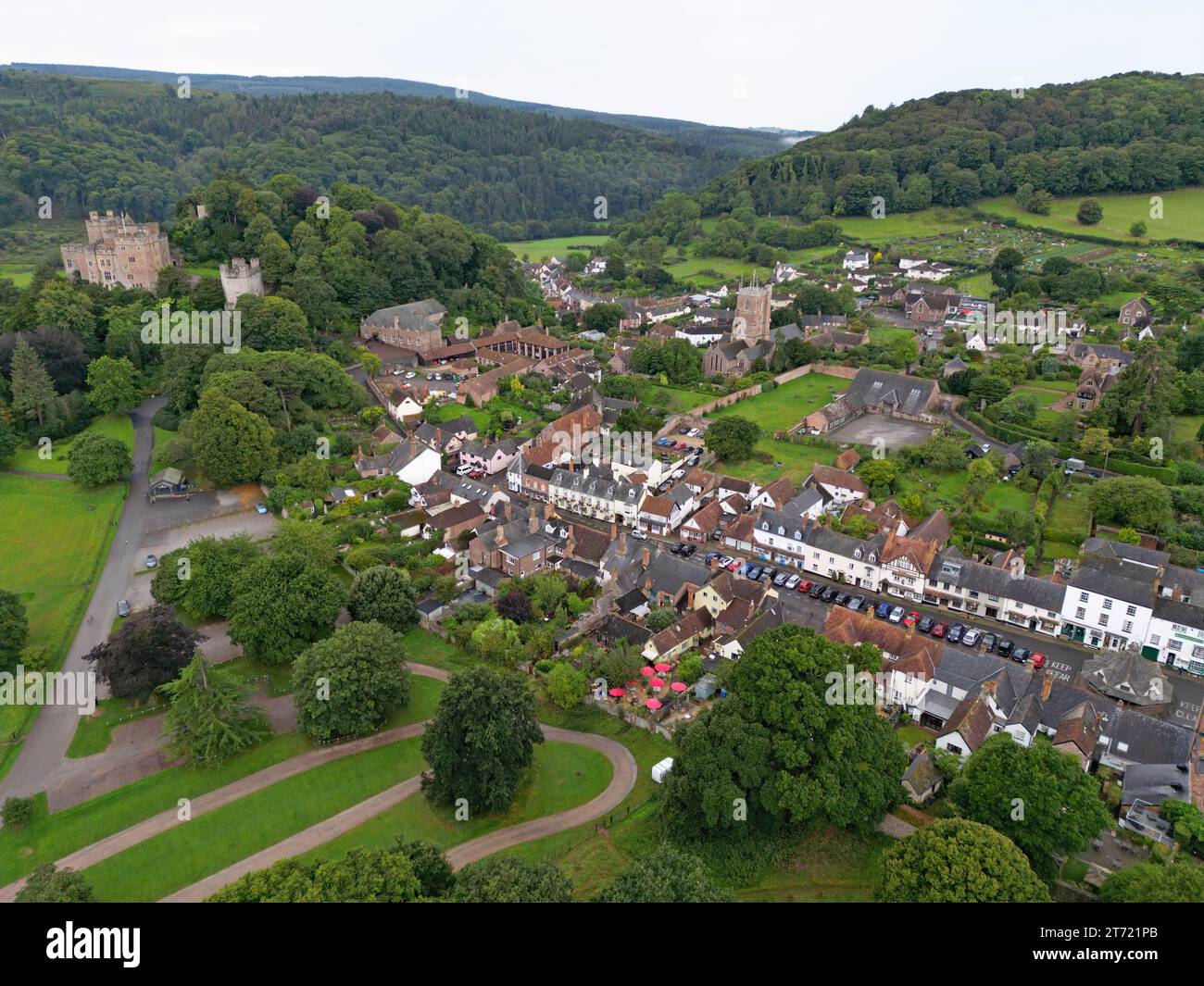 Aerial drone view of Dunster Castle and historic village of Dunster ...