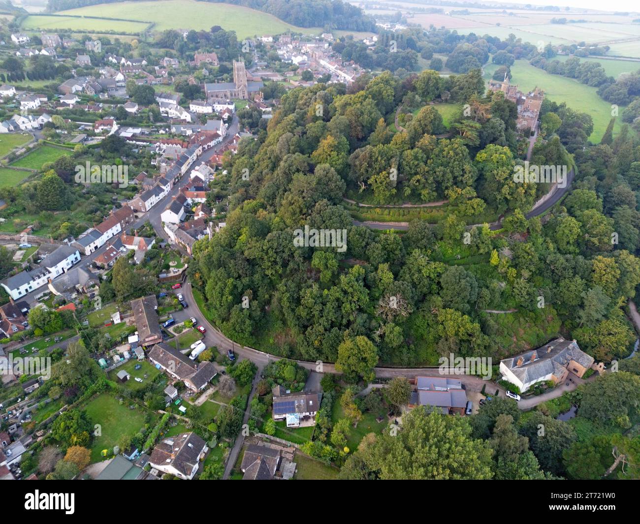 Aerial drone view of Dunster Castle and historic village of Dunster ...