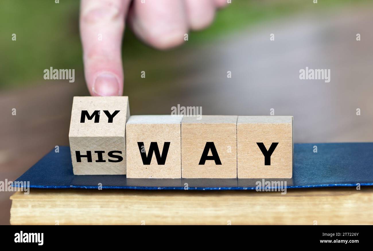Hand turns dice and changes the expression 'his way' to 'my way' Stock ...