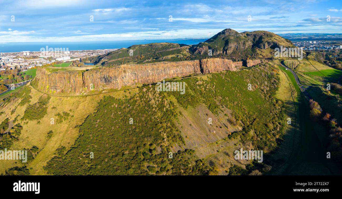 Aerial view of Salisbury Crags with Arthur’s Seat to rear in autumn in Holyrood Park, Edinburgh ...