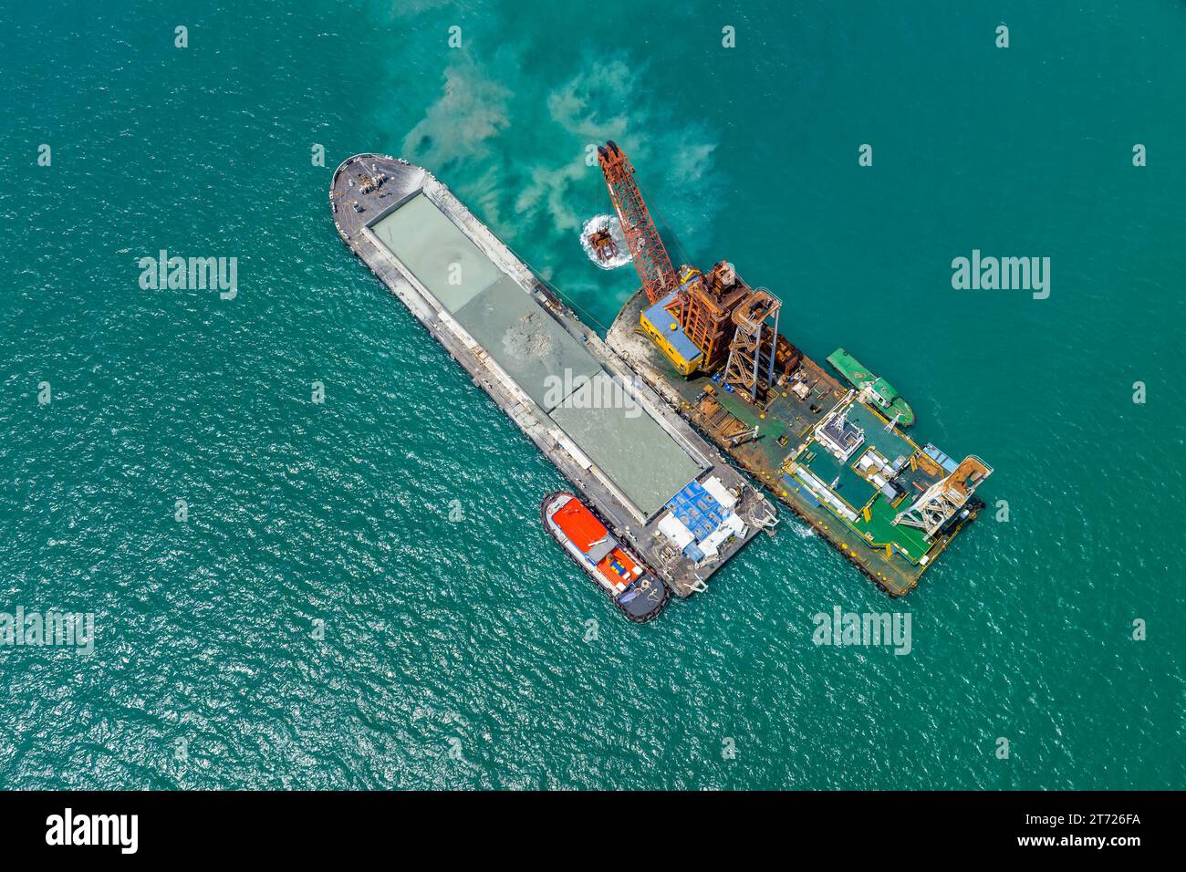 Sand dredger on floating platforms in ocean Stock Photo - Alamy