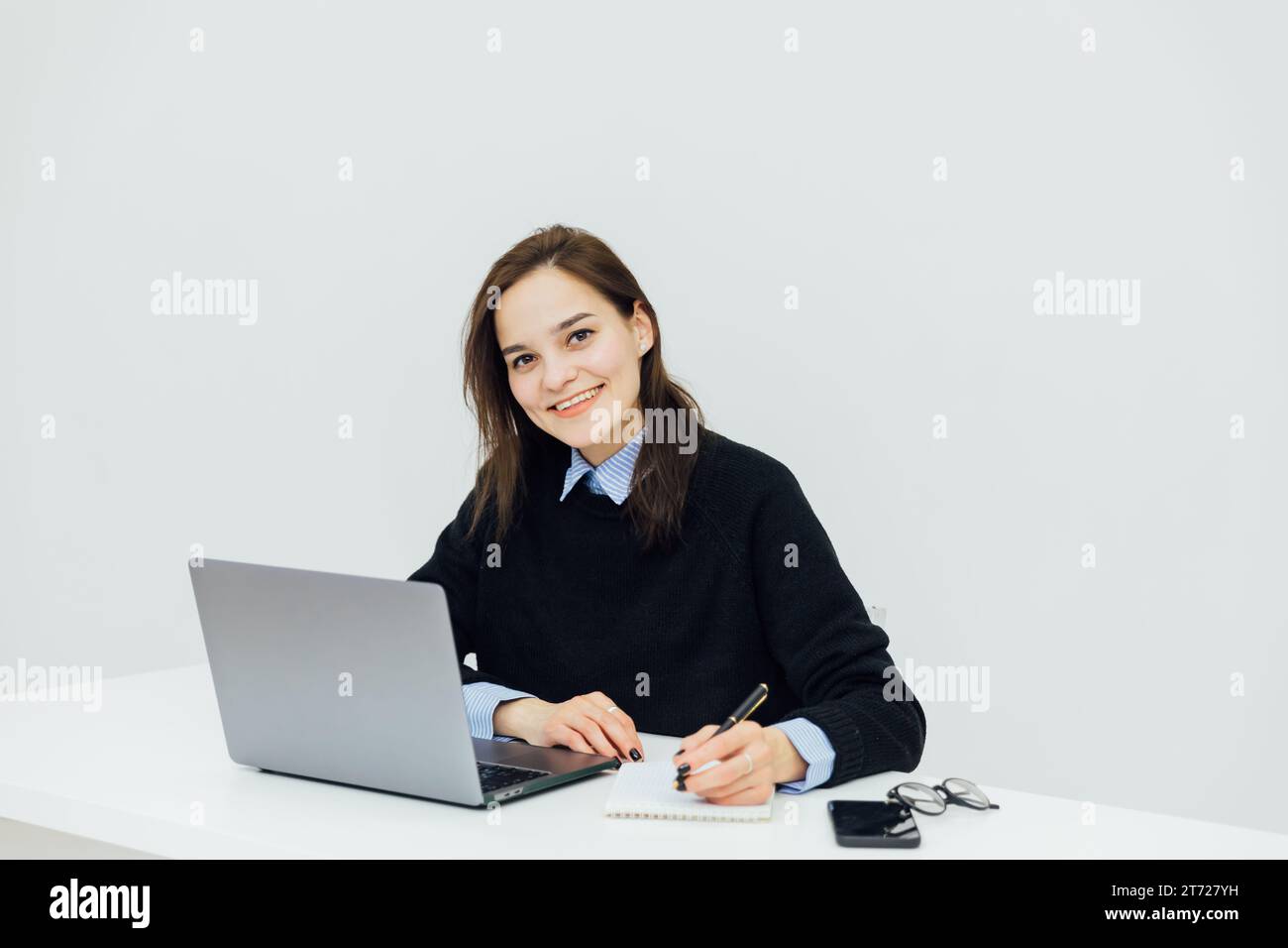 woman at the computer in the office at a remote work Internet ...