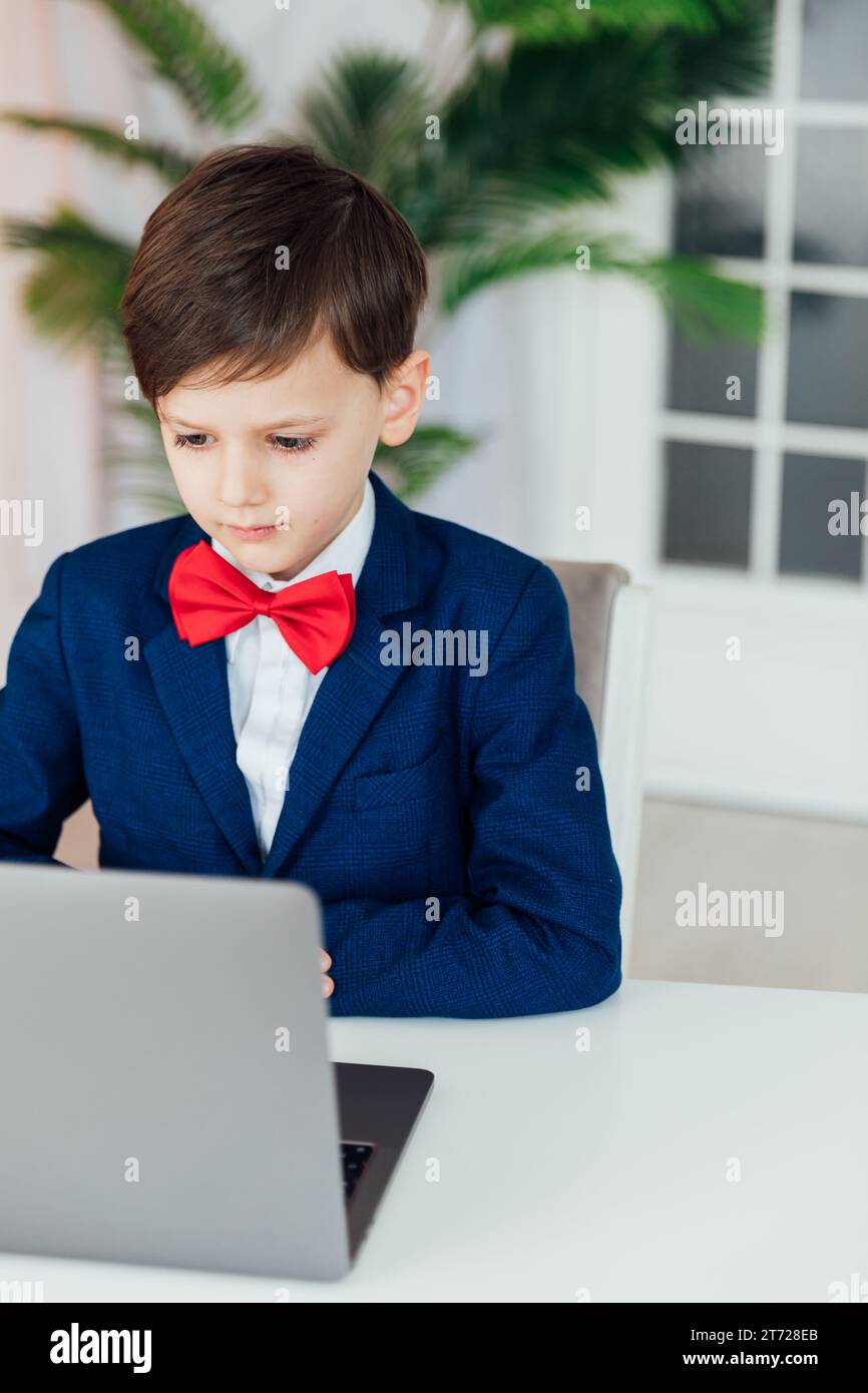 boy at the computer in the classroom learning online school IT ...
