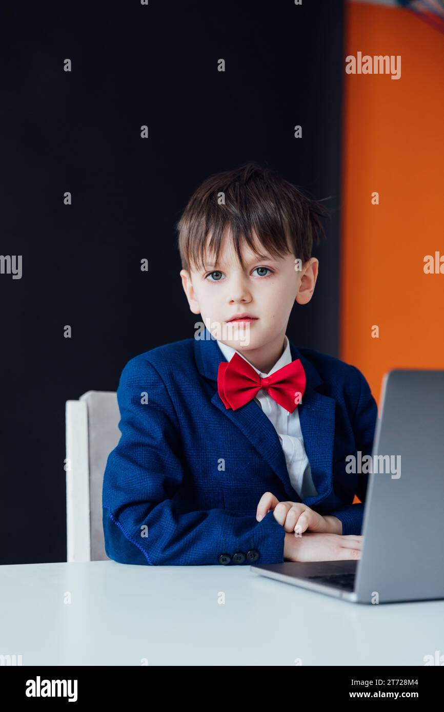 online learning boy at the computer in the classroom Stock Photo - Alamy