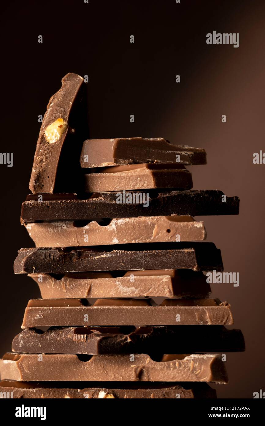 Chocolate tower, variety of different broken chocolate pieces Stock ...