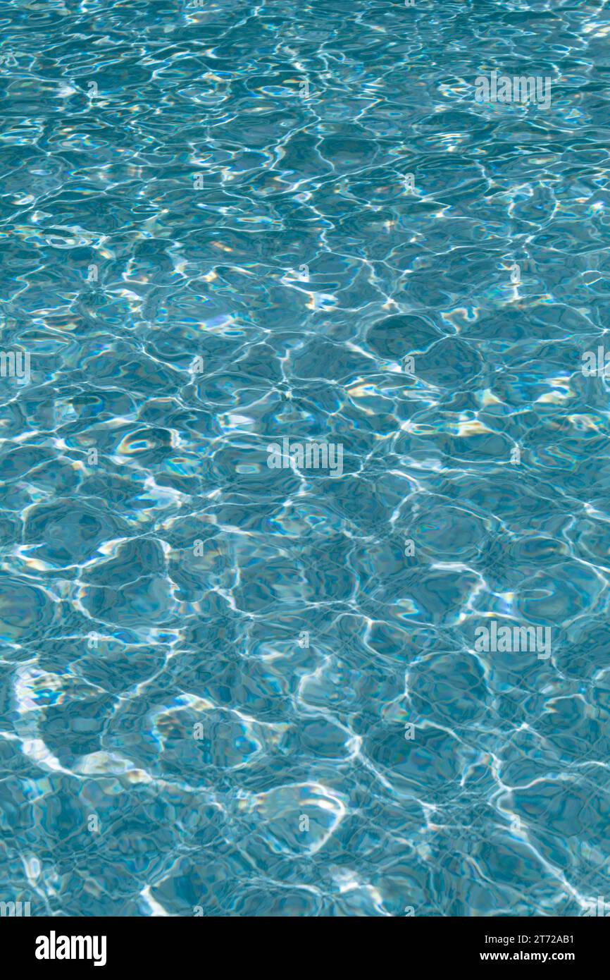 Clear reflection of sunlight on blue water in a pool Stock Photo - Alamy