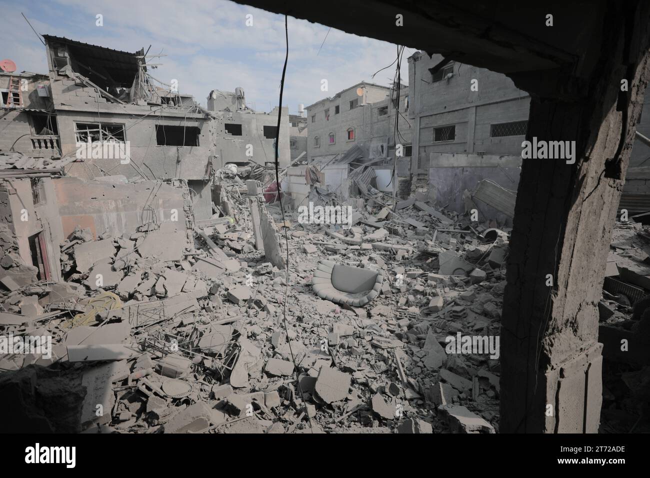 Palestinians inspect the destroyed house of Ghanem family, following an ...