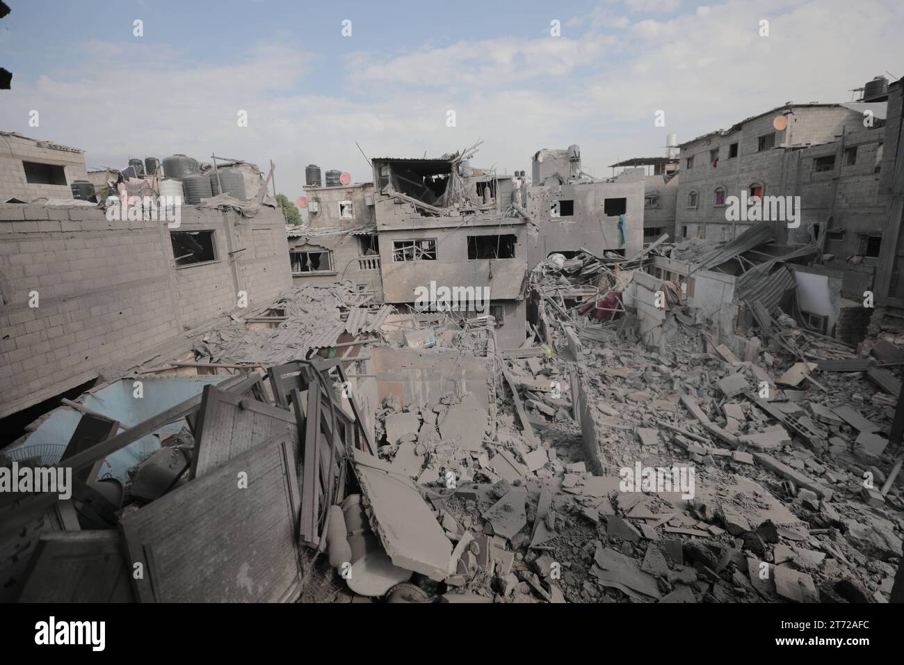 Palestinians inspect the destroyed house of Ghanem family, following an ...