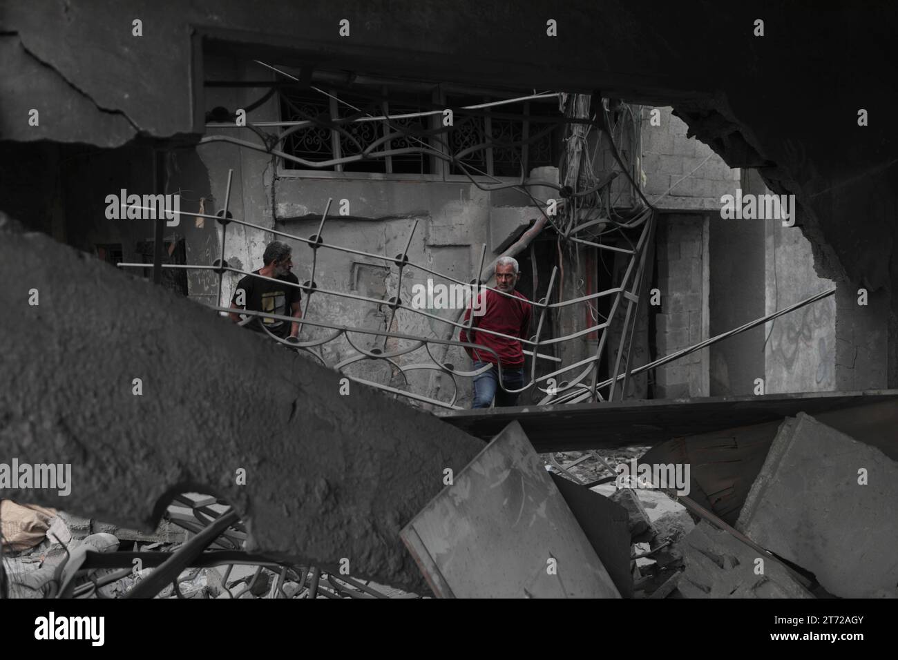 Palestinians inspect the destroyed house of Ghanem family, following an ...