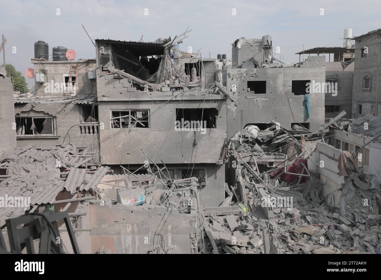 Palestinians inspect the destroyed house of Ghanem family, following an ...
