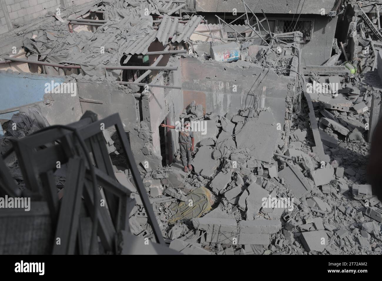 Palestinians inspect the destroyed house of Ghanem family, following an ...