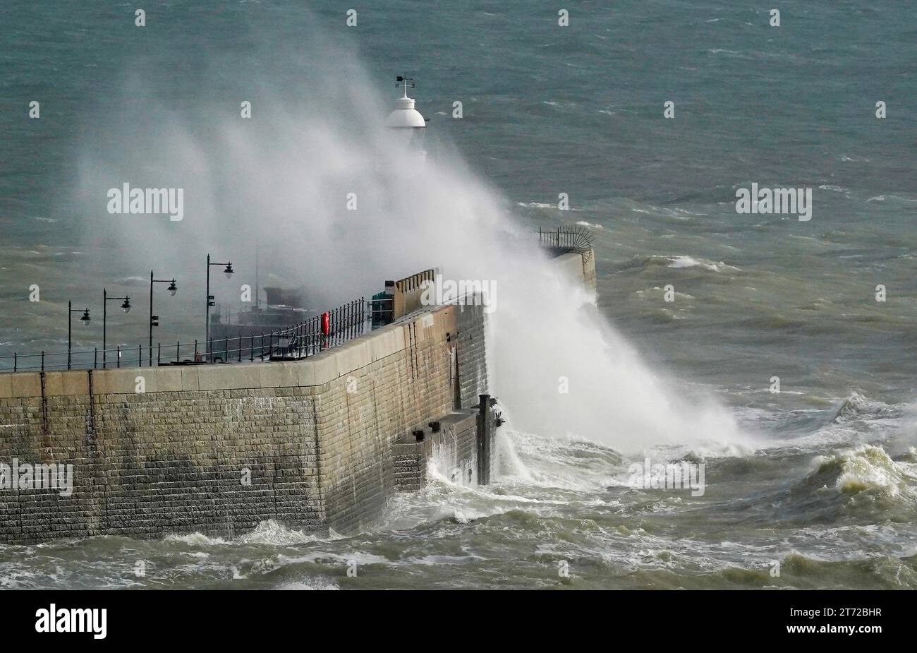Waves crash over the harbour arm in Folkestone, Kent. Amber weather ...