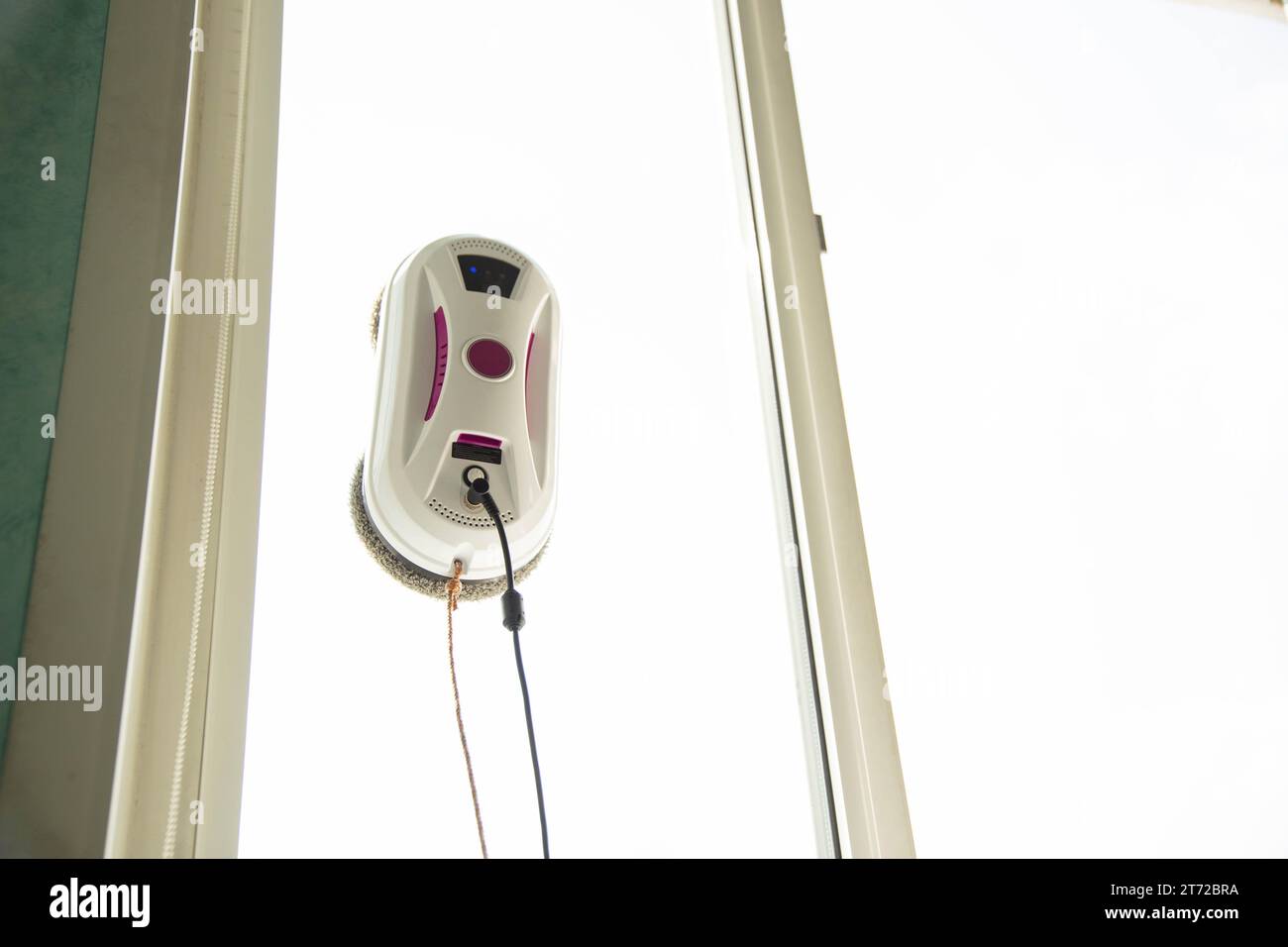 Modern device for cleaning glass from dirt and streaks. Robot washer ...