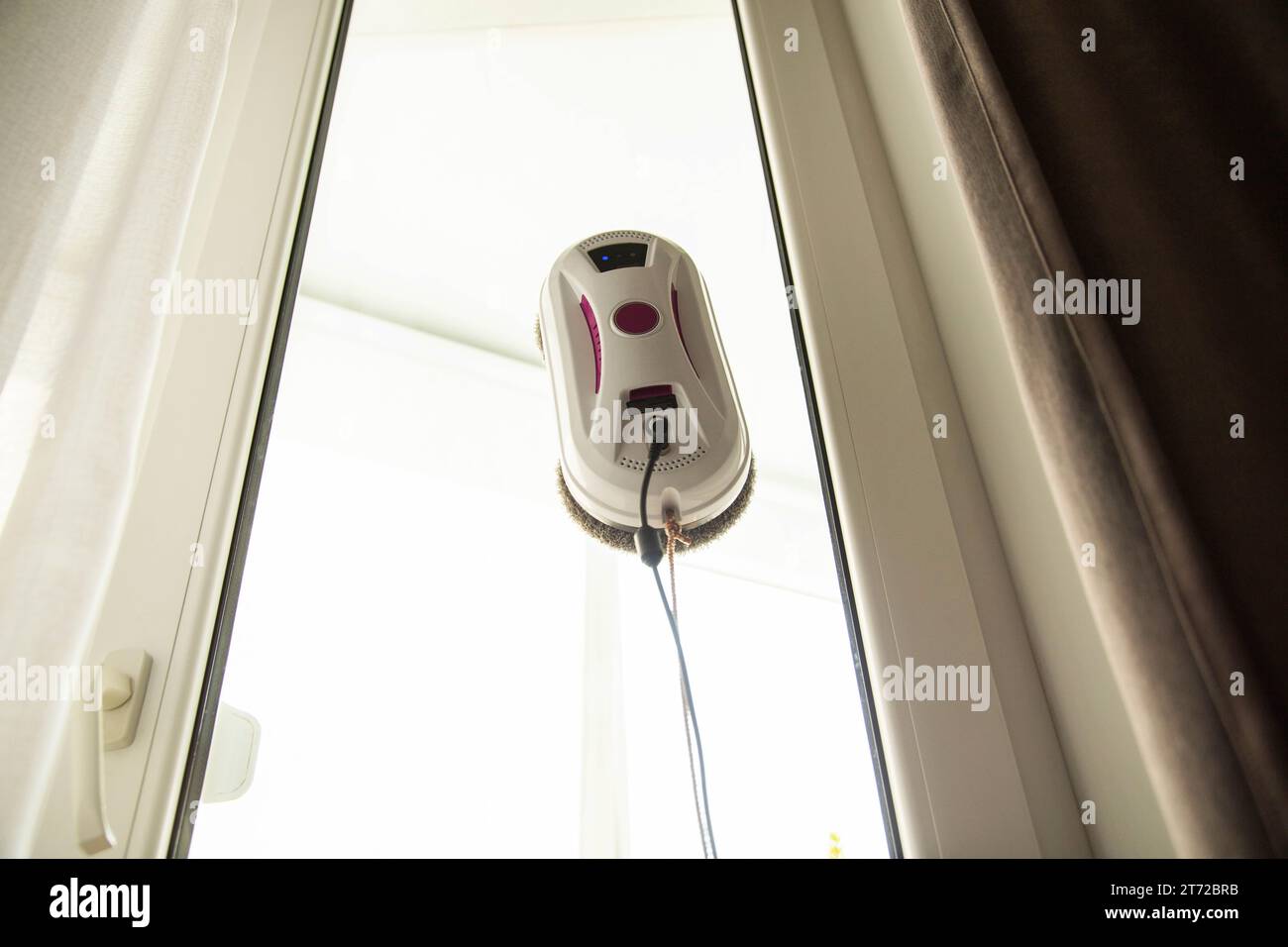 Modern device for cleaning glass from dirt and streaks. Robot washer ...