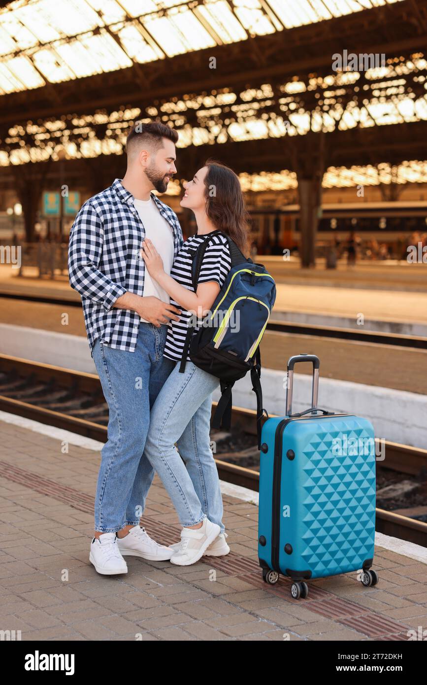 Long-distance relationship. Beautiful couple on platform of railway station Stock Photo - Alamy