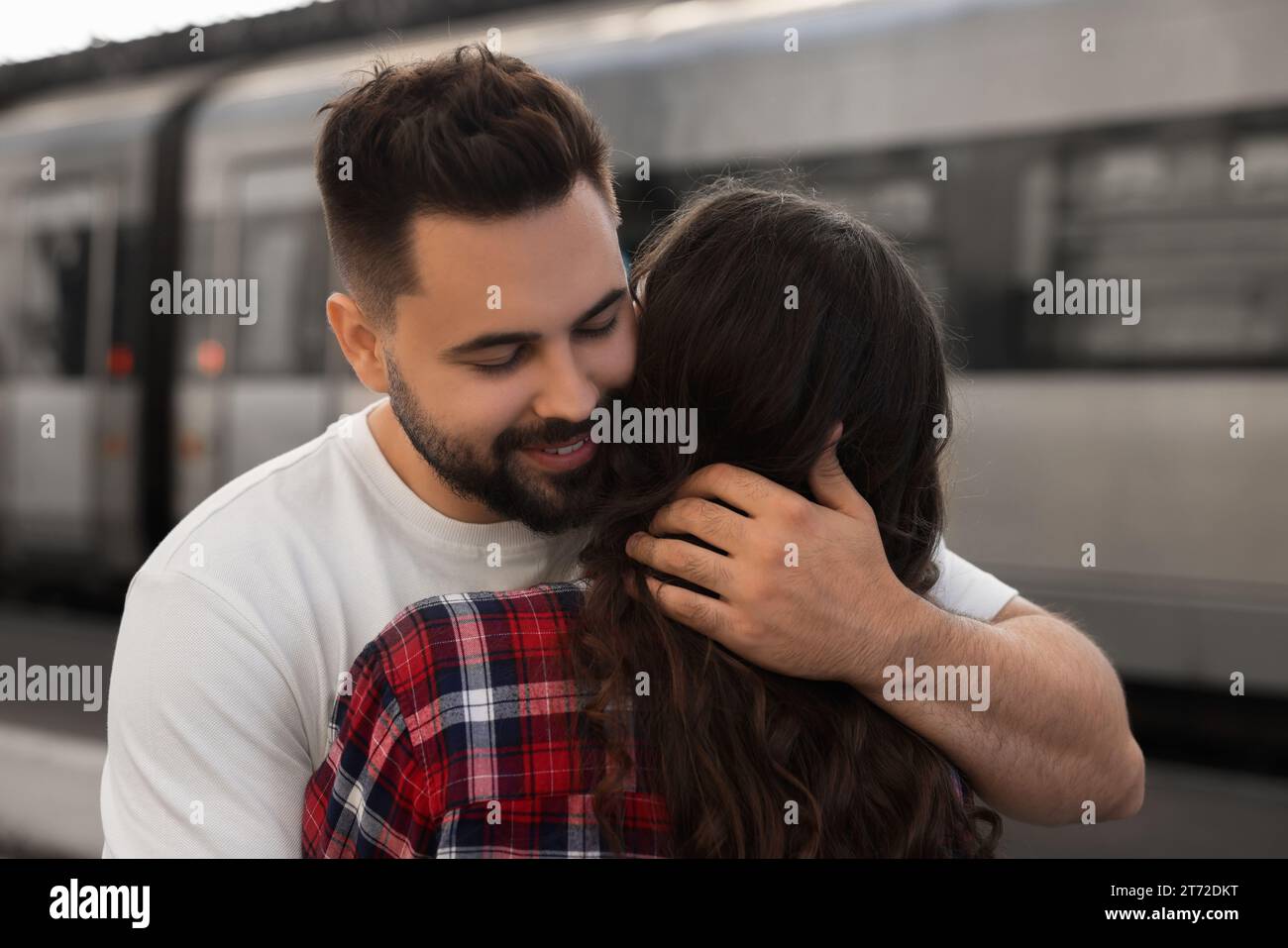 Long-distance relationship. Couple hugging on platform of railway station Stock Photo - Alamy
