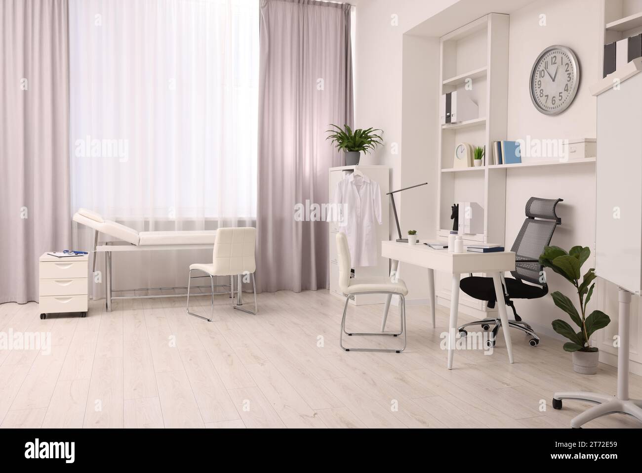 Modern medical office interior with doctor's workplace and examination ...