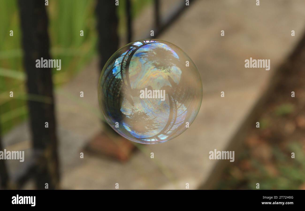 One beautiful clear soap bubble floating outdoors Stock Photo - Alamy