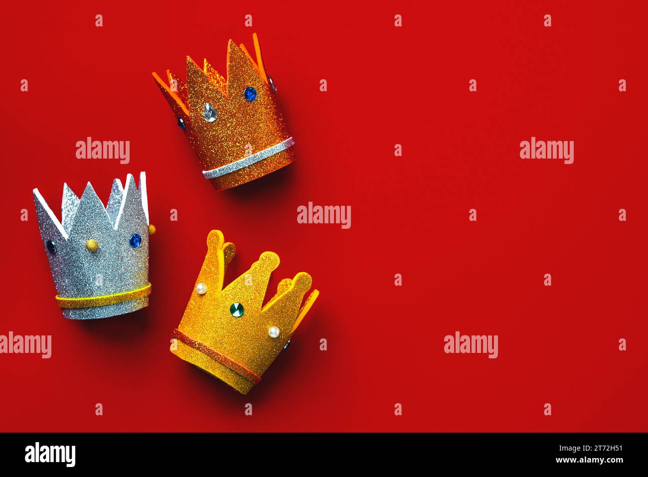 Three crowns of the three wise men with copy space over red background ... Three crowns of the three wise men with copy space over red background ...