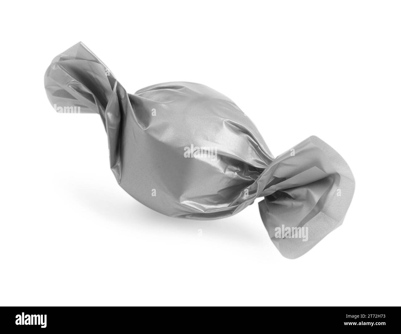 Tasty candy in silver wrapper isolated on white Stock Photo - Alamy