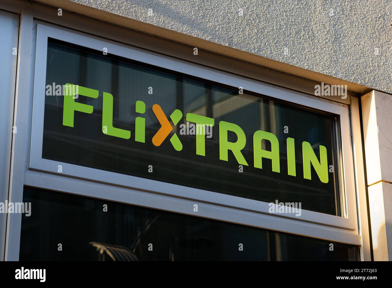 FlixTrain logotype on a building of a ticket service. Logo sign of the ...