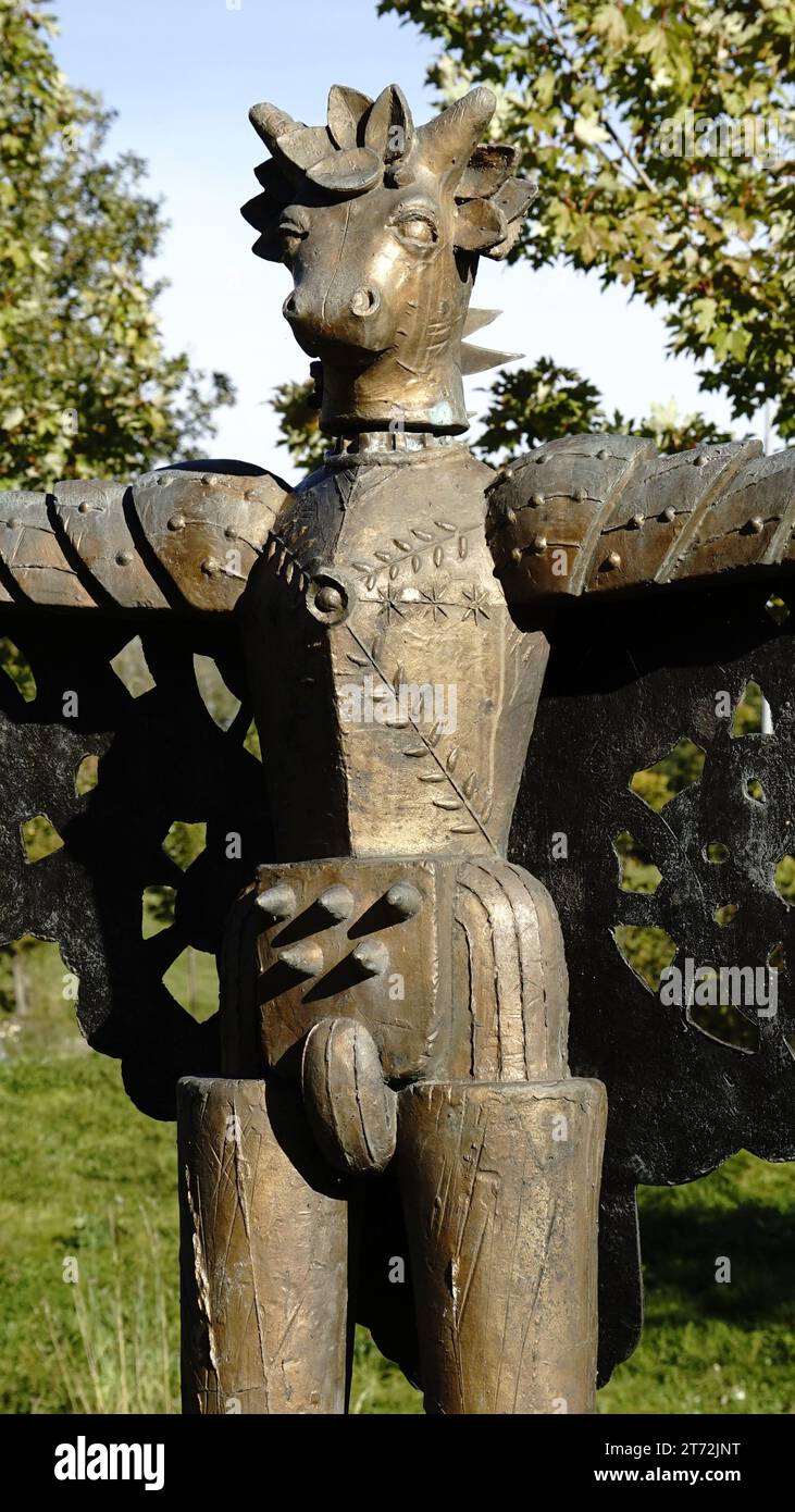 A high-resolution close-up photograph of an ornately carved stone bird ...