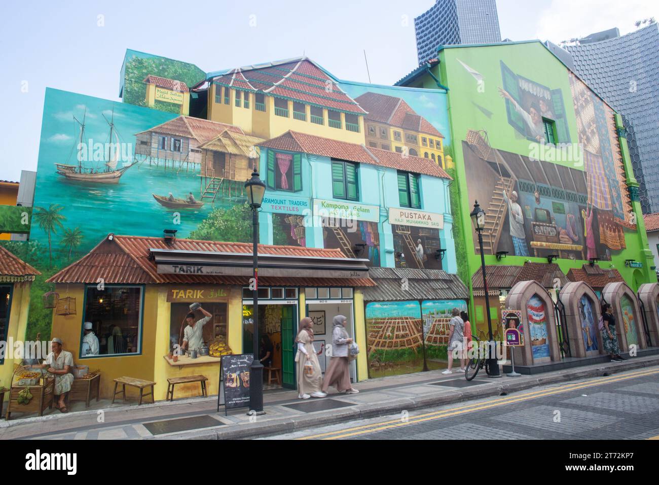 Visitors are checking out the massive scale wall mural that depicts the ...
