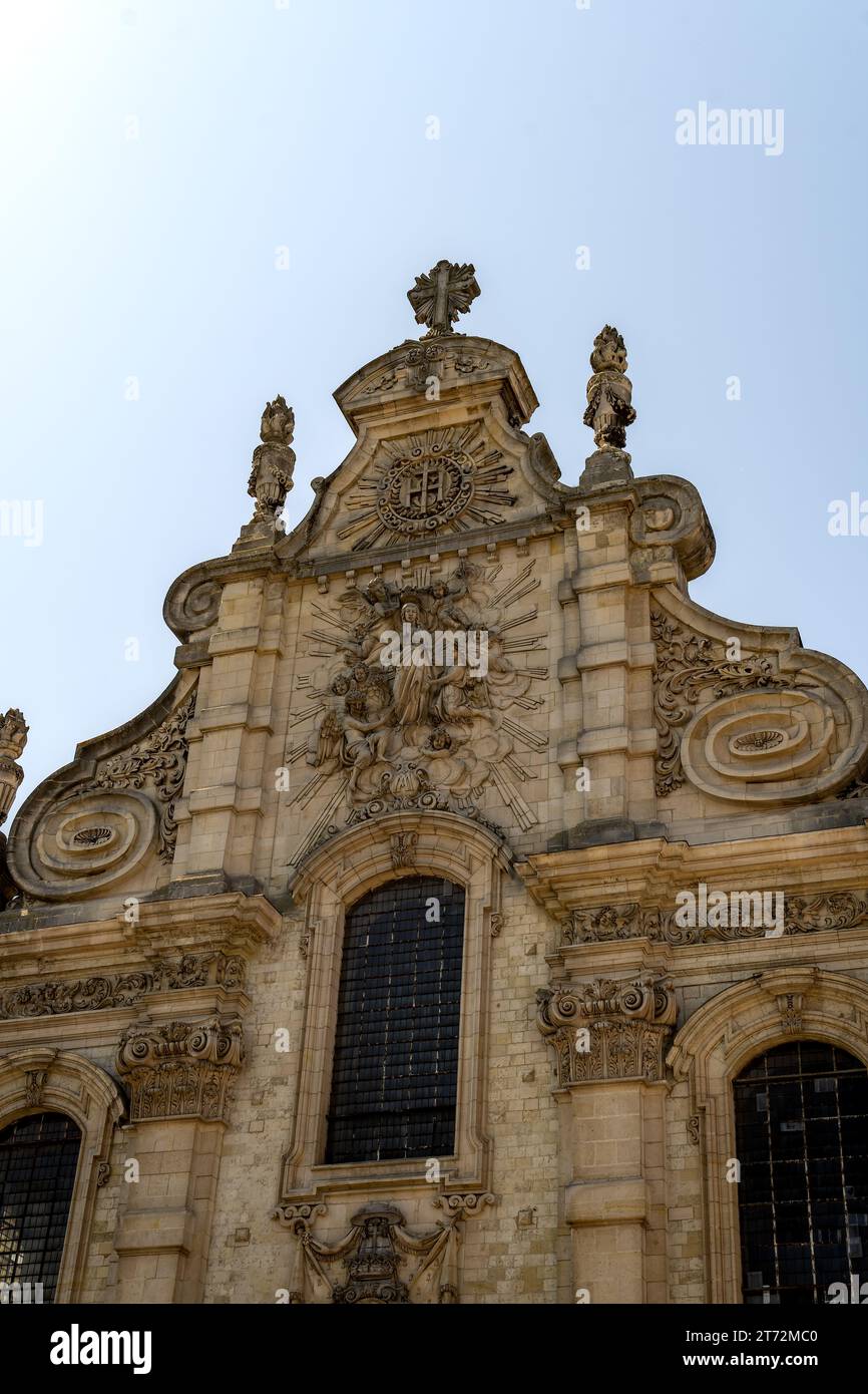 A side view of an aged, historic building featuring intricate carvings ...