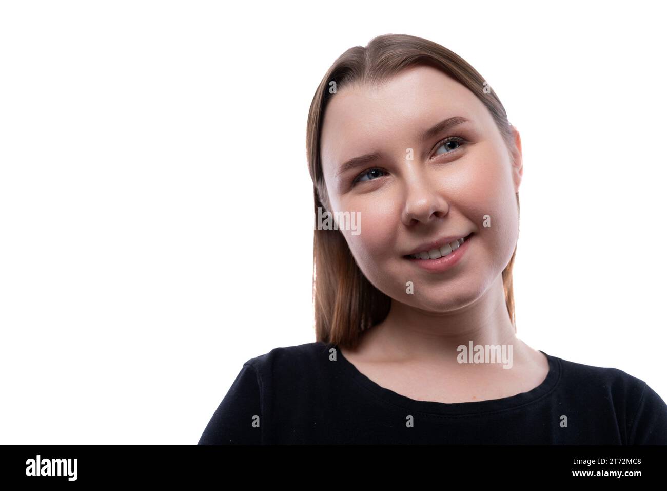 Cunning pre-teen girl with brown hair on a white background Stock Photo ...